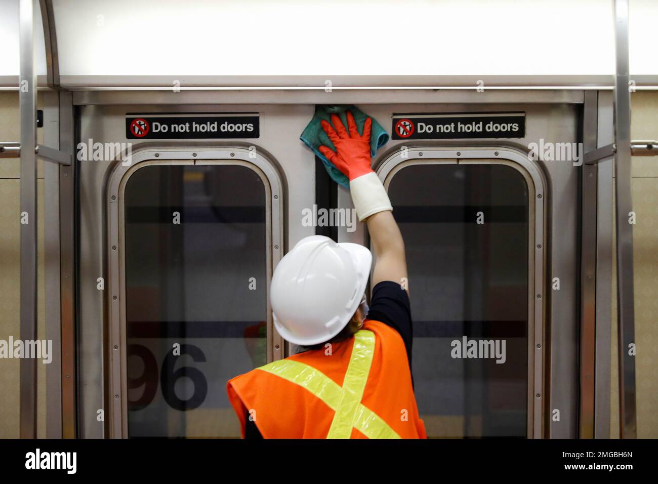 Contractors clean subway cars at the 96th Street station to control the ...