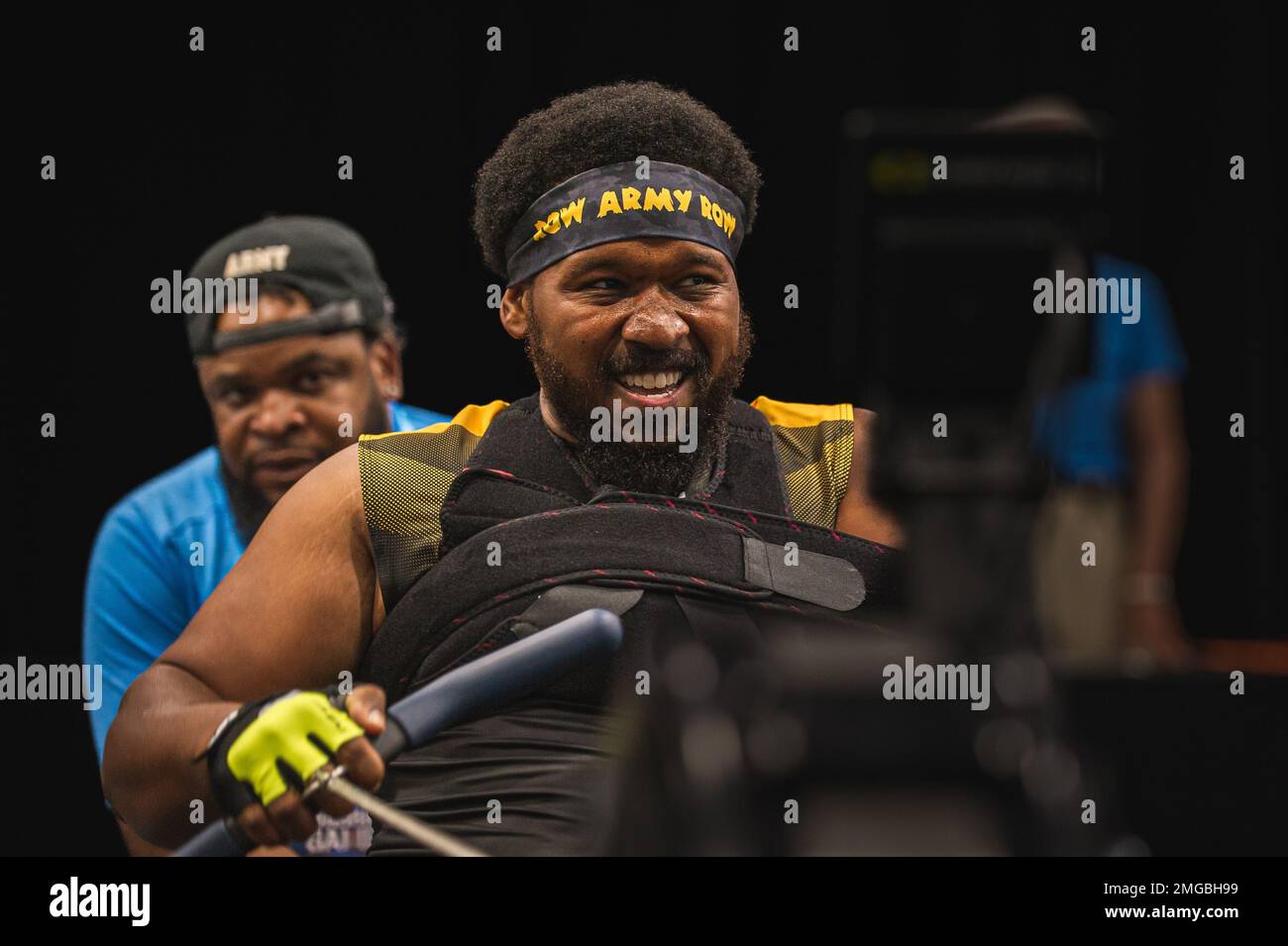 Retired U.S. Army Spc. David Snypes, Jr. heaves while competing in an ...