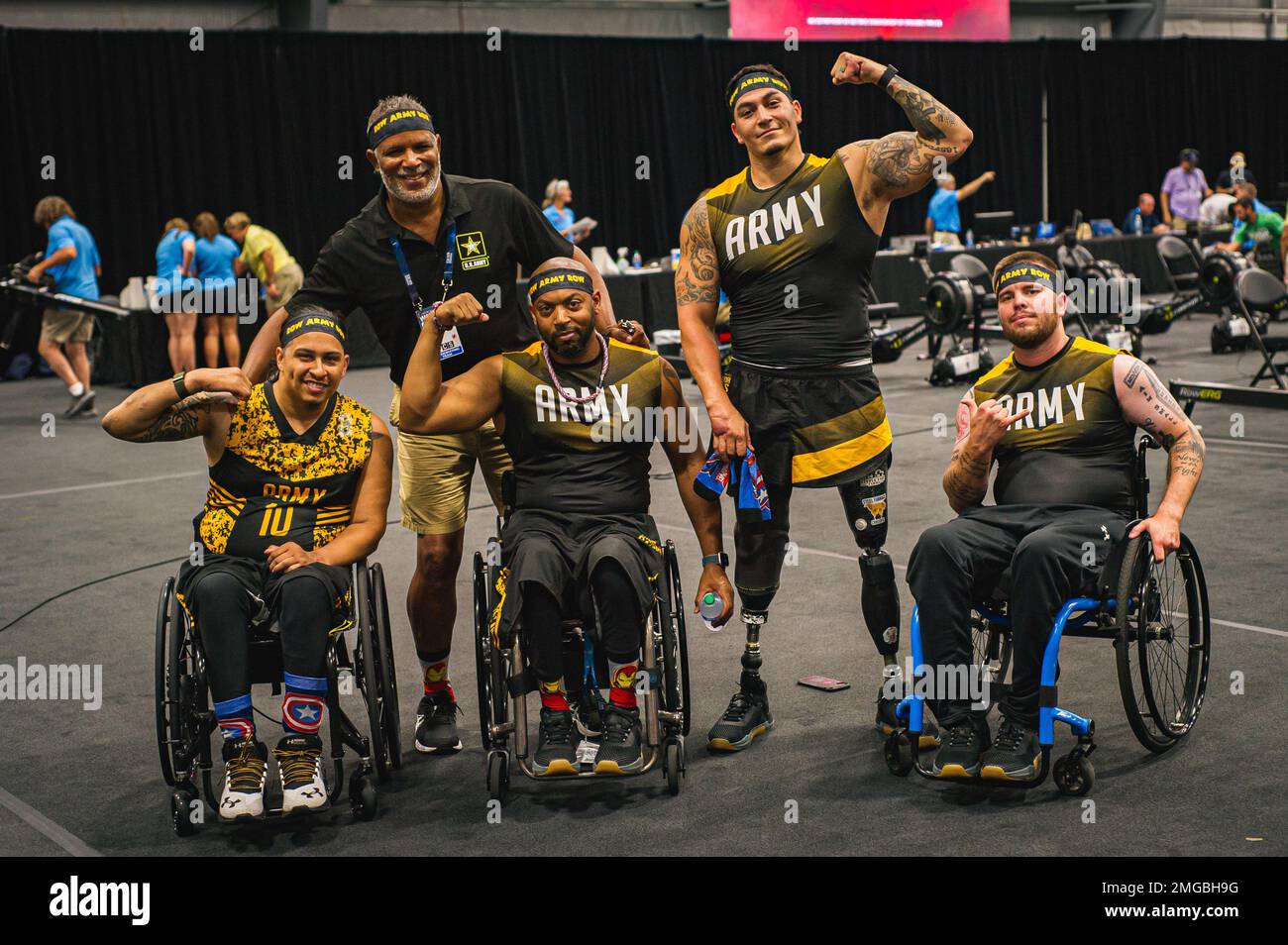 Team Army athletes pose for a photo after competing in an indoor rowing ...