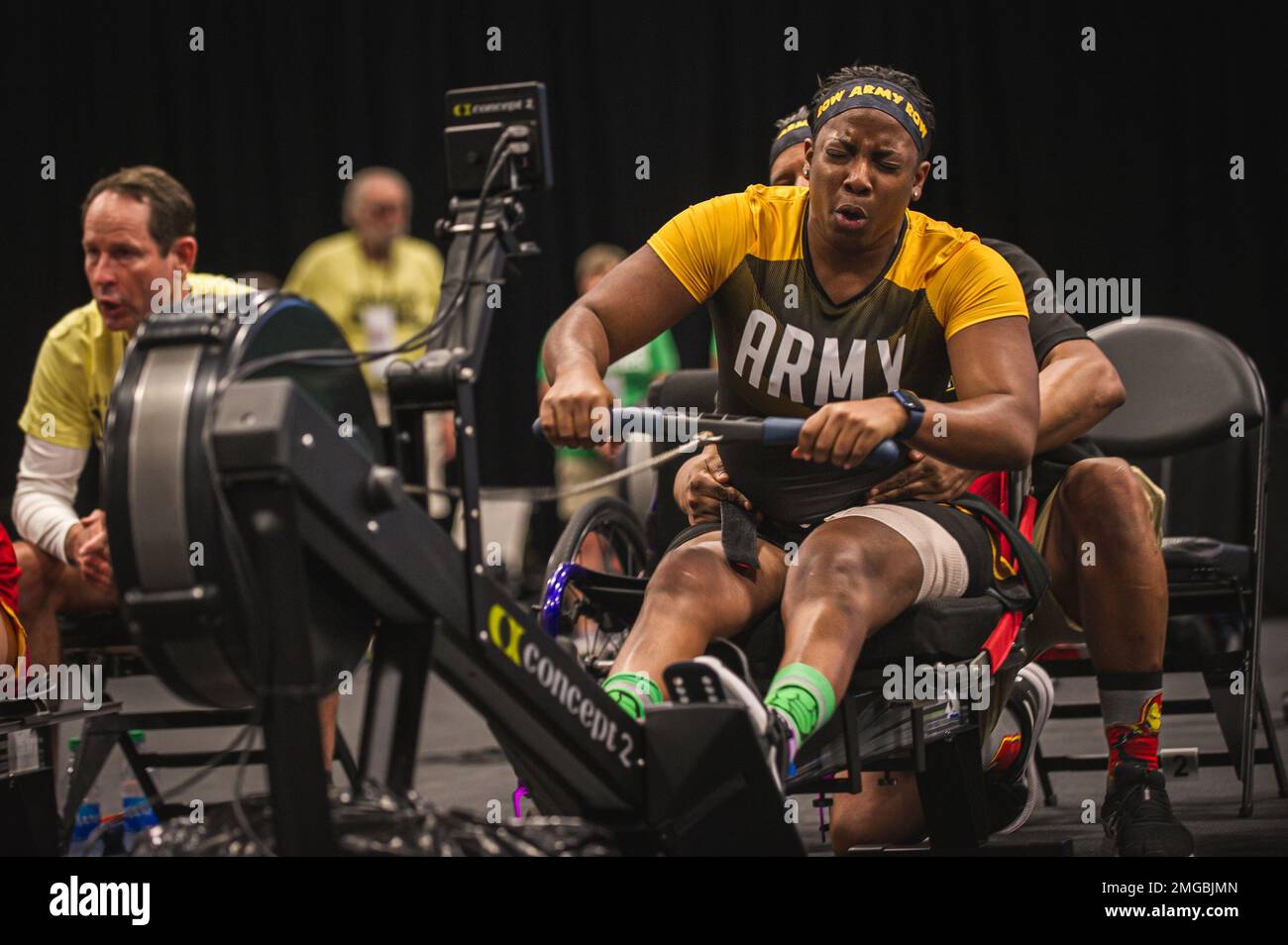 U.S. Army Pfc. Corine Hamilton heaves her way through the indoor rowing ...
