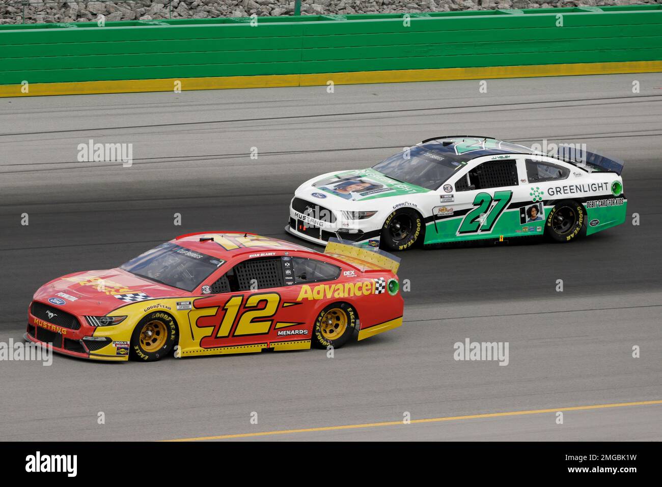 Ryan Blaney, left, and JJ Yeley (27) run during a NASCAR Cup Series ...