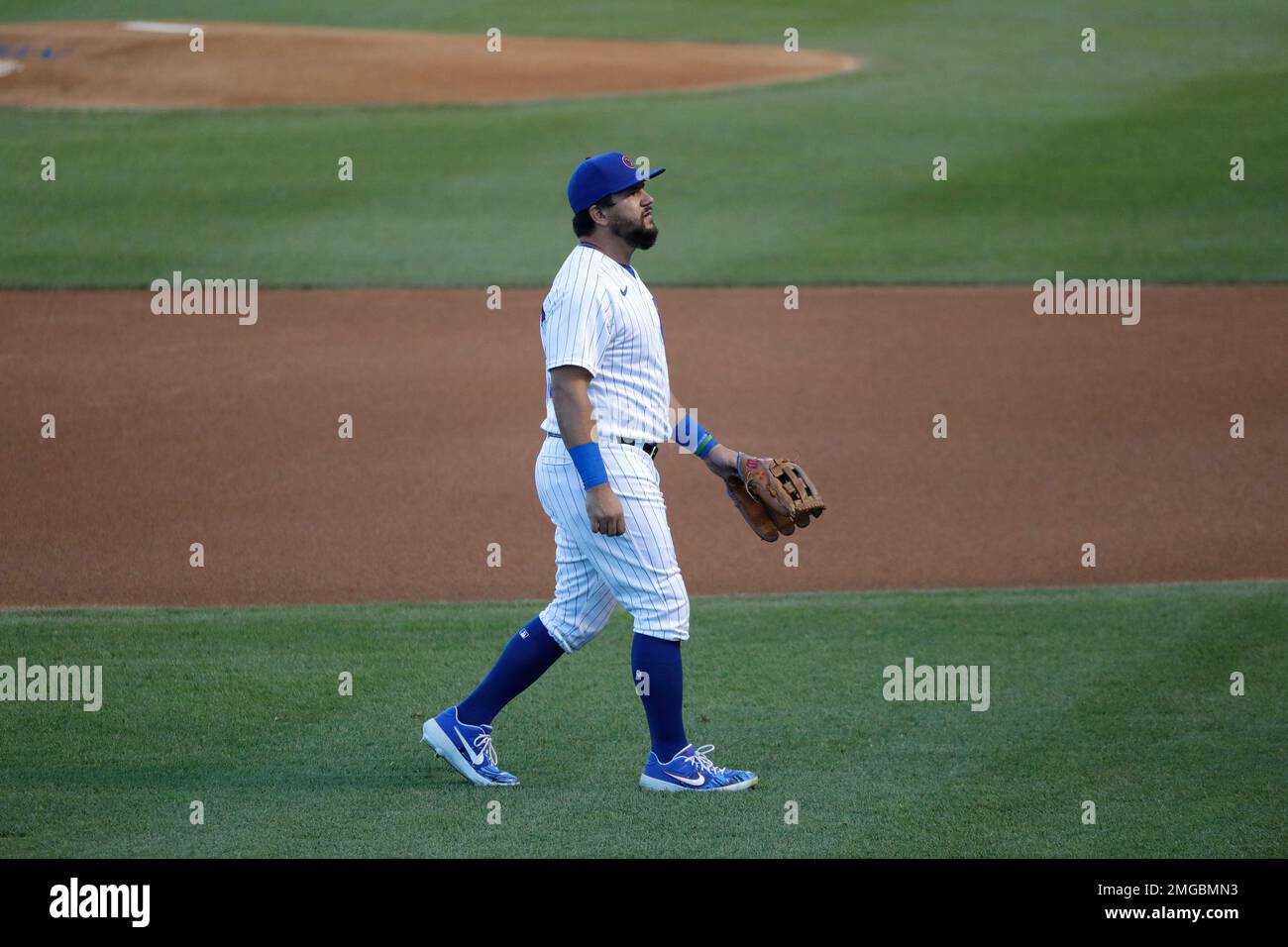 Chicago Cubs outfielder Kyle Schwarber walks on the field during ...