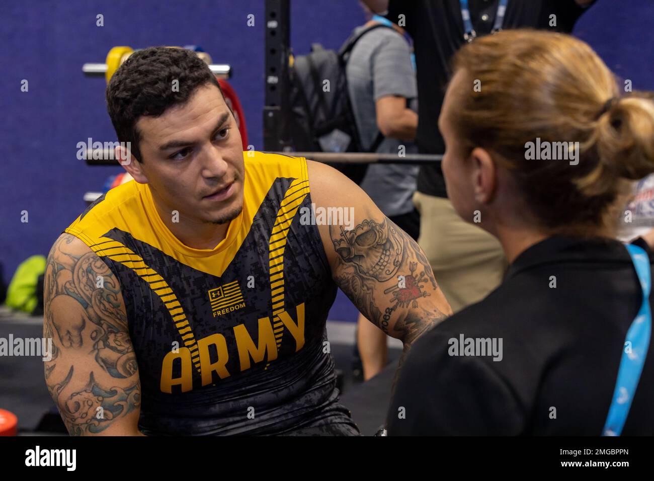 Retired U.S. Army Staff Sgt. Jason Smith talks with his coach during ...