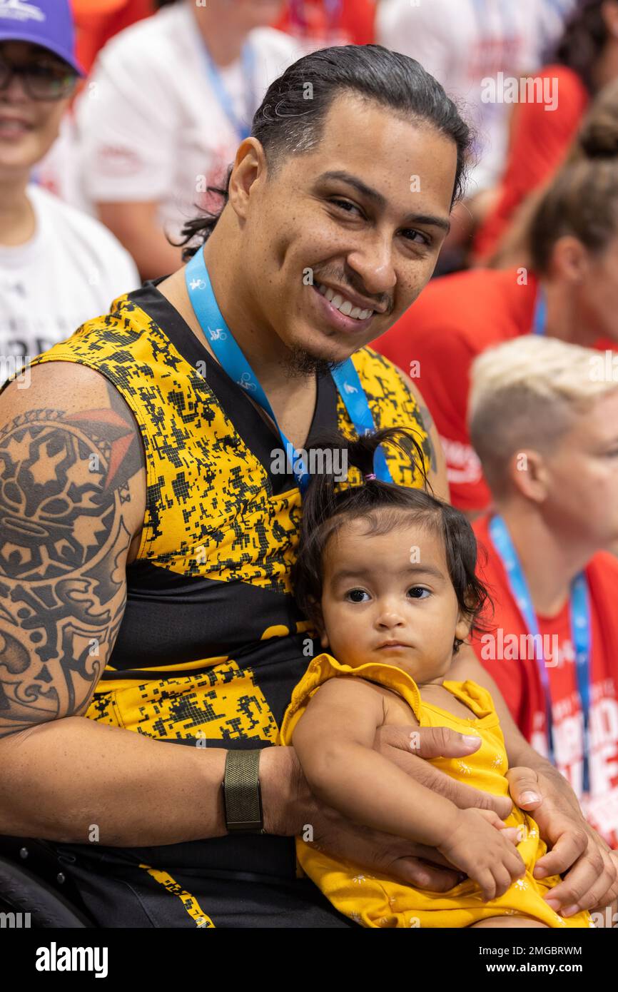 Retired U.S. Staff Sgt. Army Joel Rodriguez poses with his daughter ...