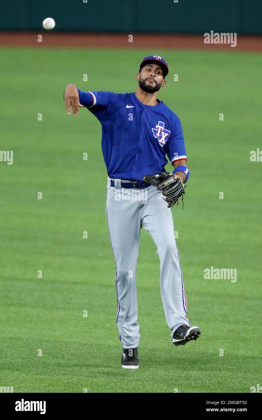 Texas Rangers' Yadiel Rivera fields a ball in an intrasquad game during ...