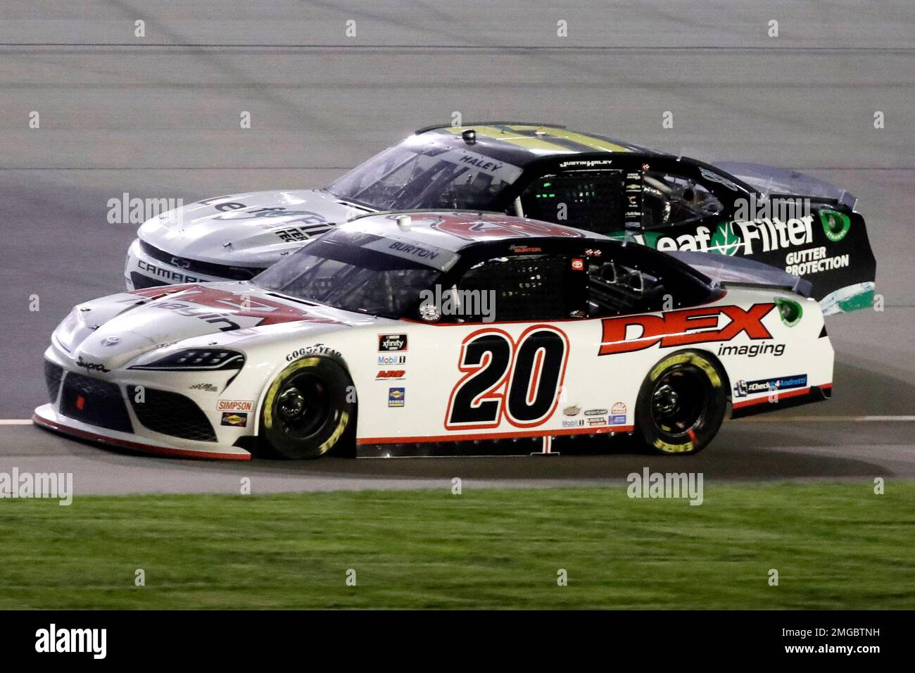 Harrison Burton (20) moves low during a NASCAR Xfinity Series auto race ...