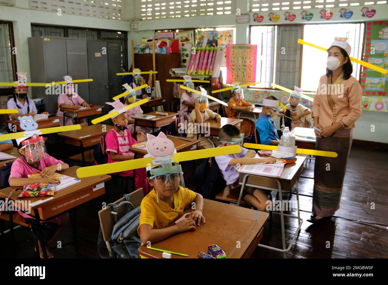 A teacher and students wearing hats designed for space keeper, practice ...
