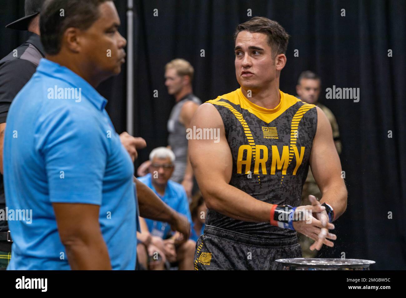 U.S. Army Capt. Juan Torres Valenzuela chalks his hands during the ...