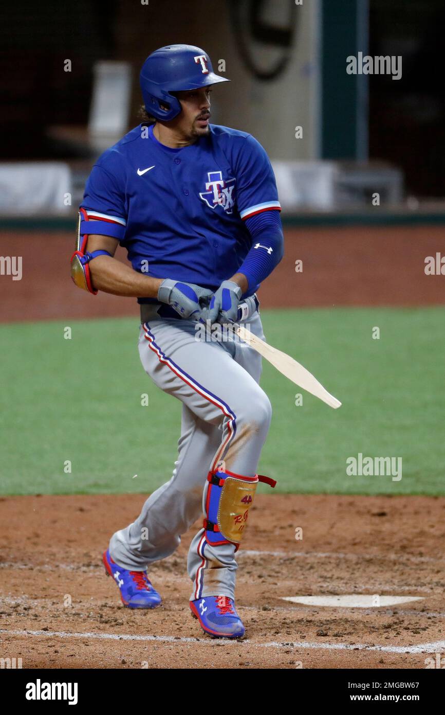 Texas Rangers Ronald Guzman follows through on a broken-bat groundout ...