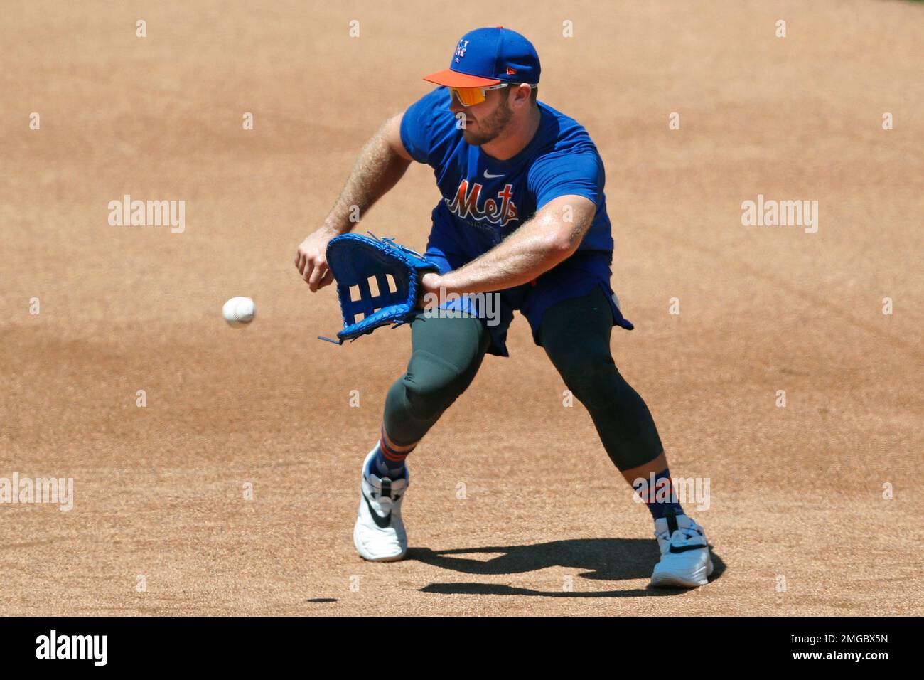 New York Mets first baseman Pete Alonso fields a ground ball hit to him ...