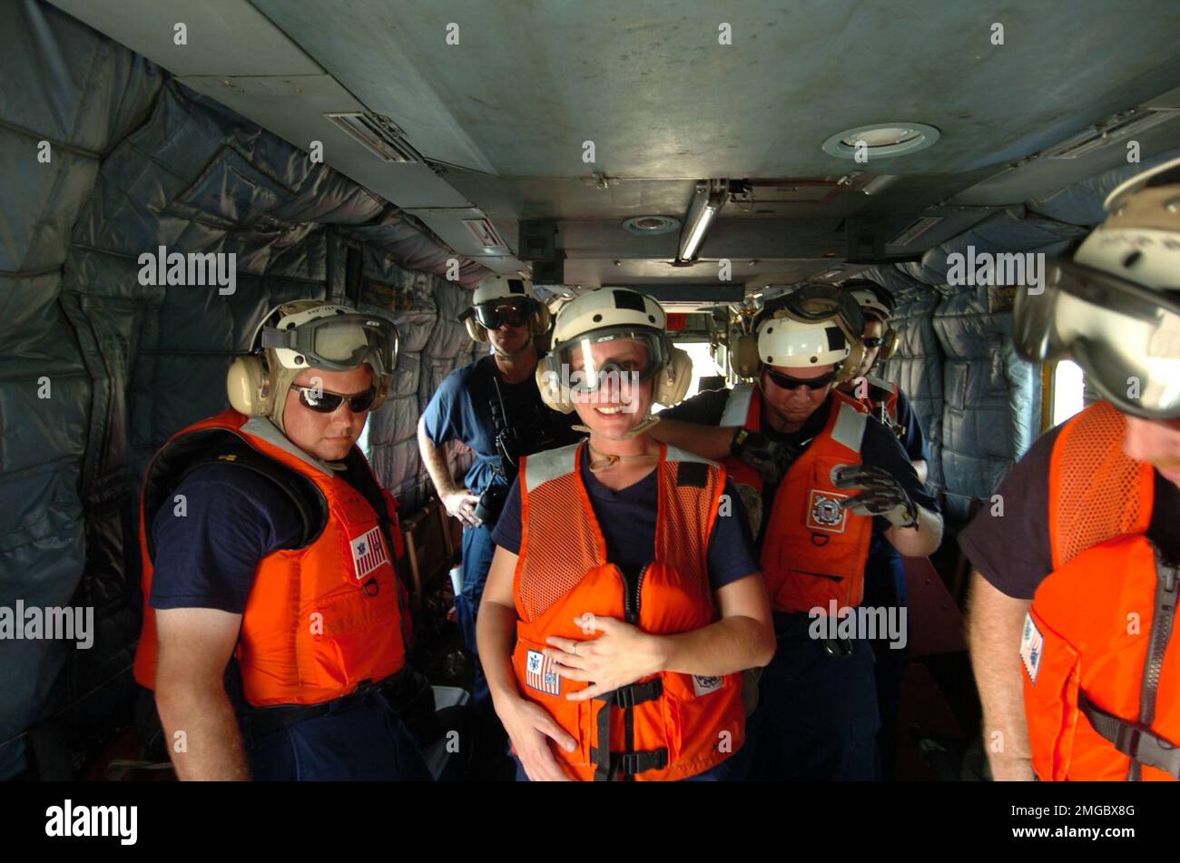Coast Guard Personnel - Miscellaneous - 26-HK-90-25. CG air crew aboard helo. Hurricane Katrina ...