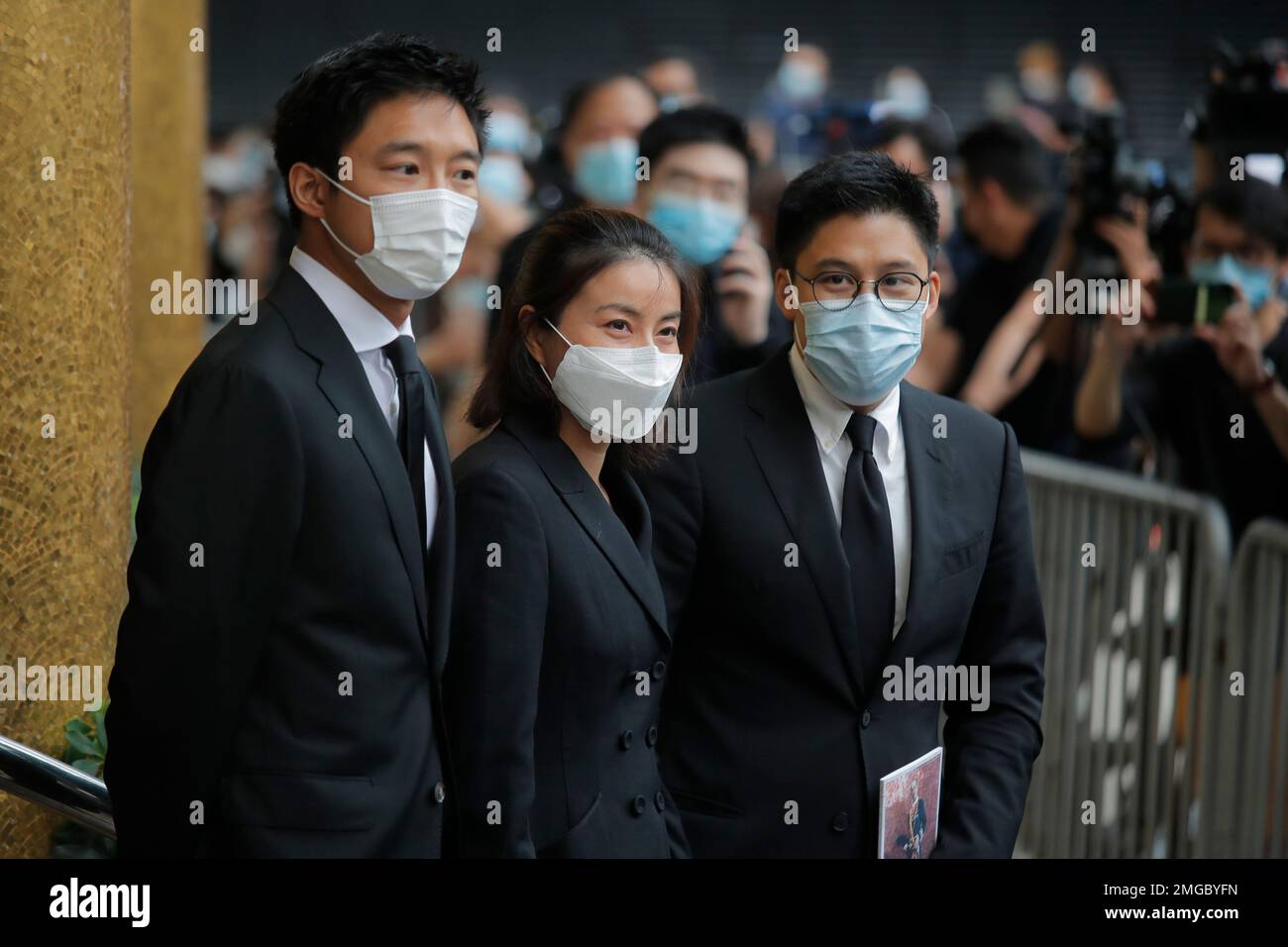 Former Chinese Olympic diving champion Guo Jingjing, center, and her ...