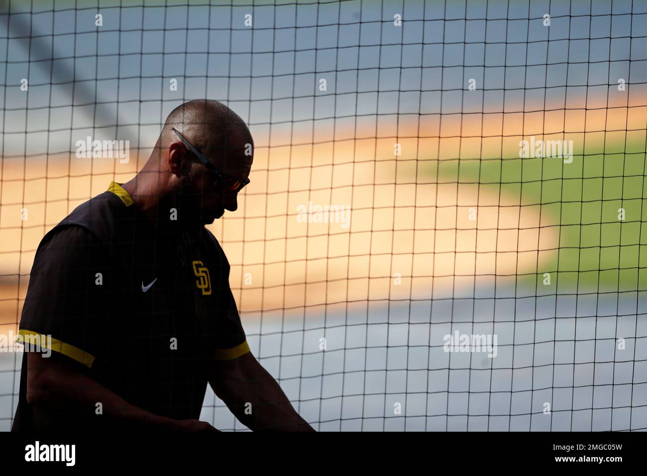 San Diego Padres manager Jayce Tingler stands behind netting during ...