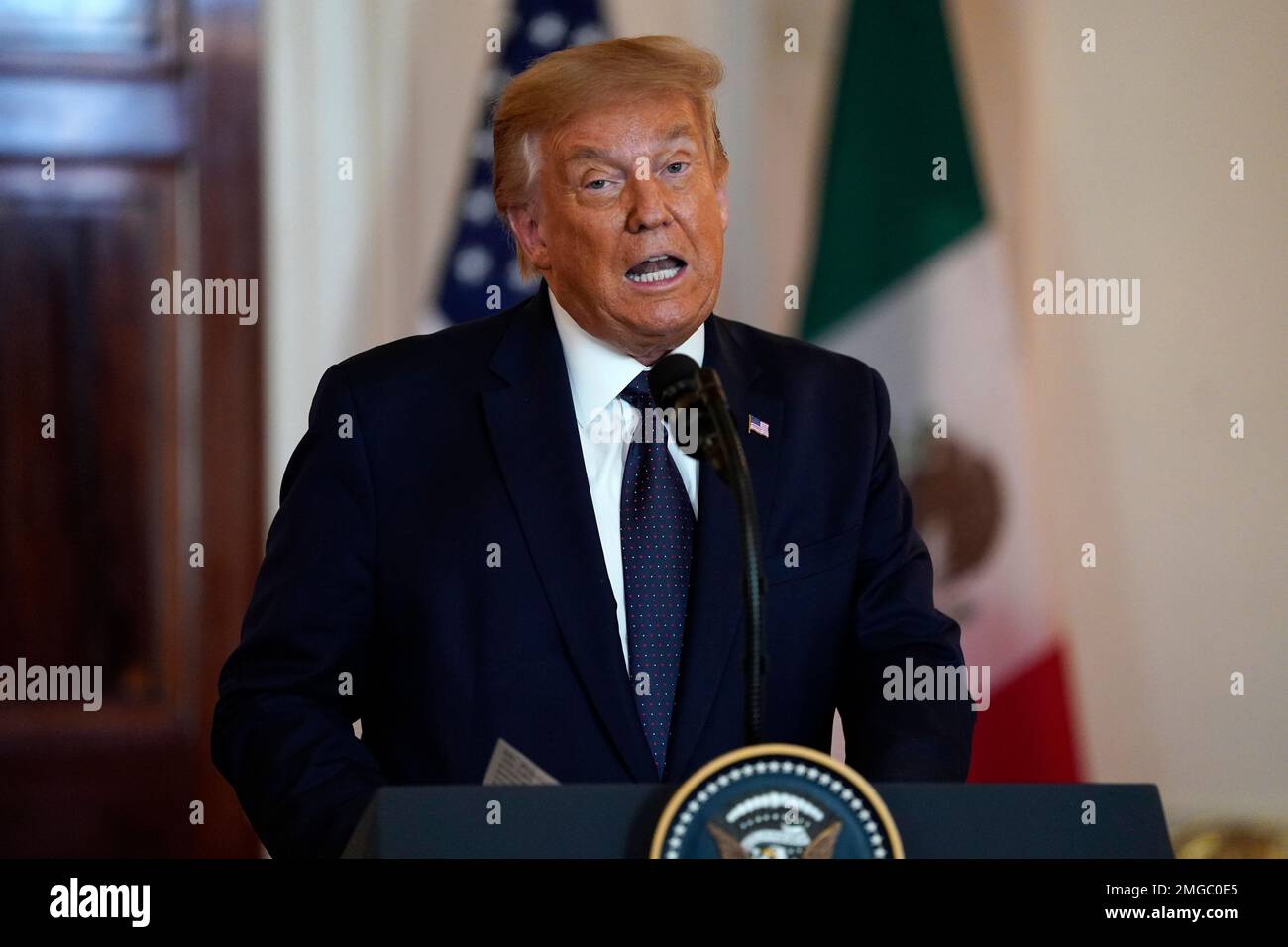 President Donald Trump delivers a statement before a dinner at the ...