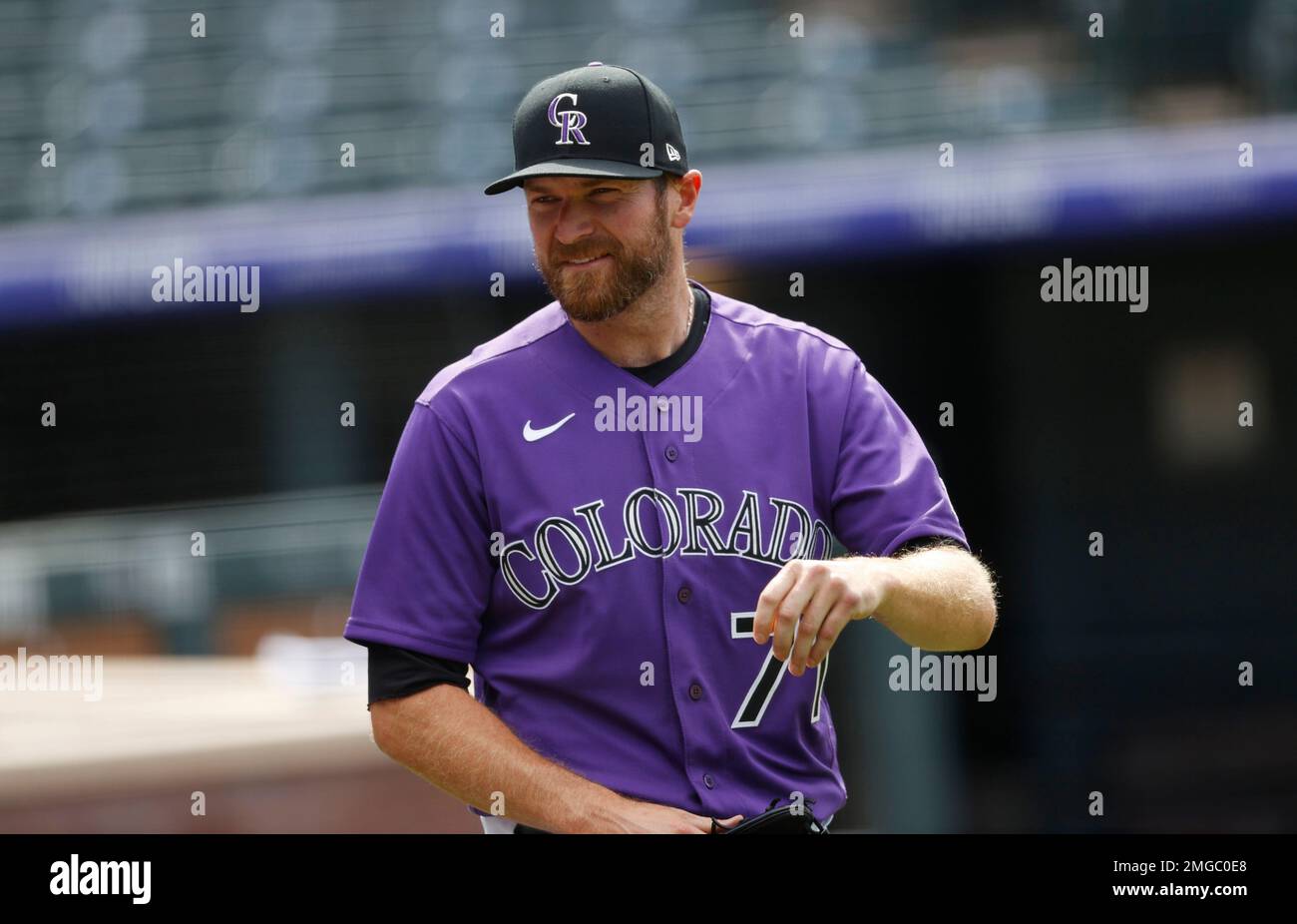 Colorado Rockies relief pitcher Wade Davis jokes with teammates as they ...