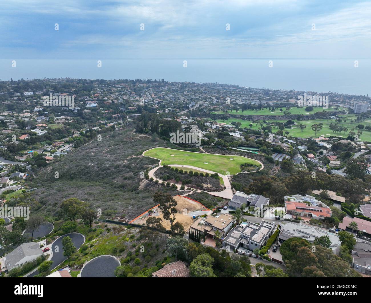 Aerial view over La Jolla Hills with big villas and ocean in the ...