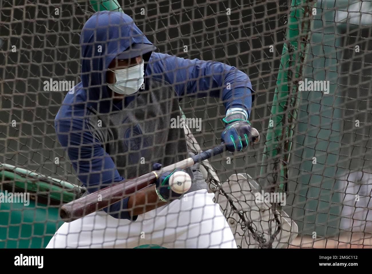 Seattle Mariners baseball player Kyle Lewis bunts during batting ...