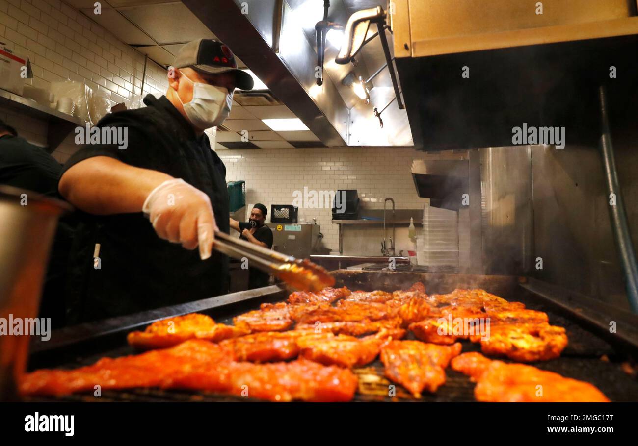 Jose Lopez cooks meals to be donated to unemployed restaurant workers ...