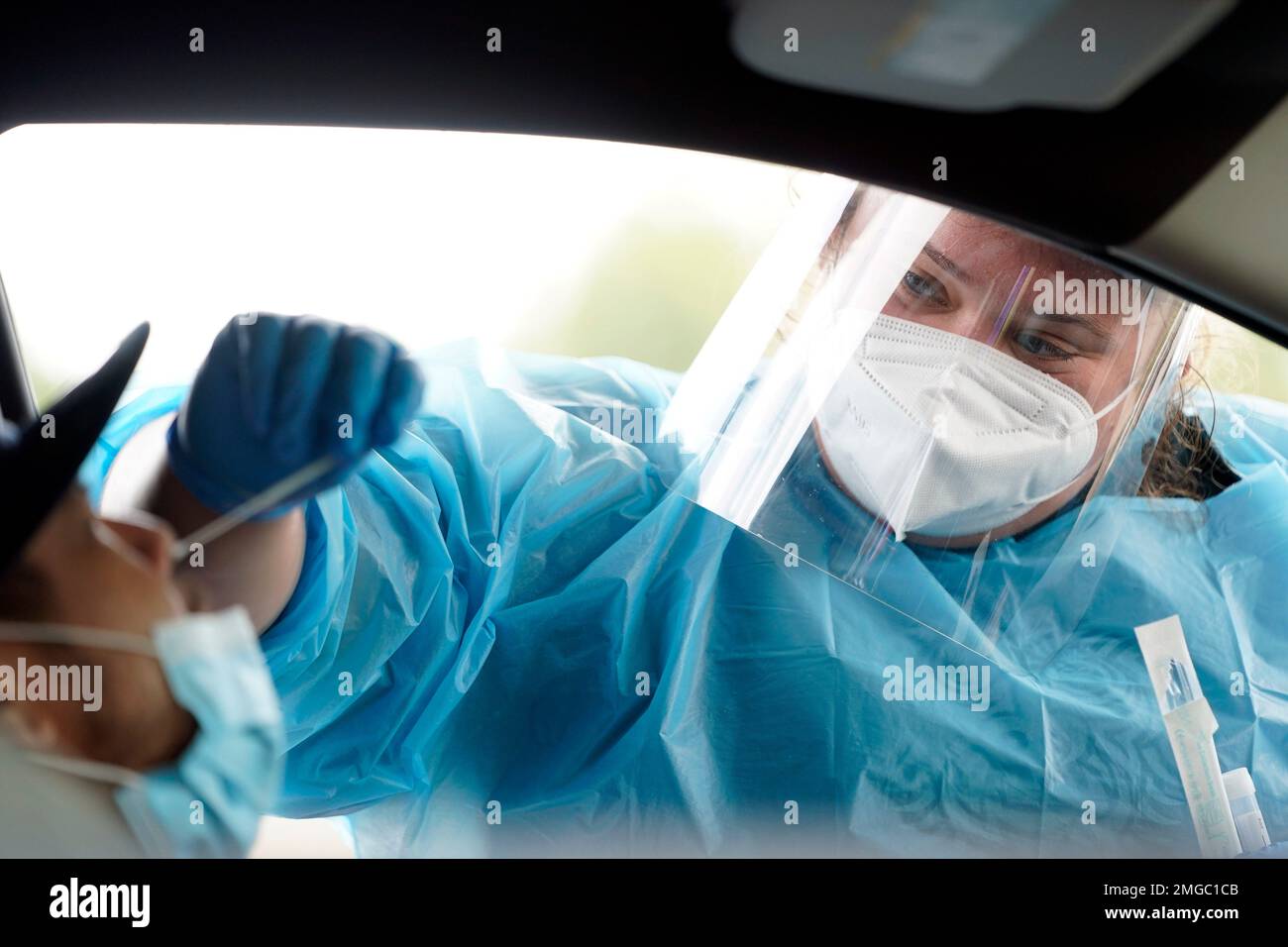 Shania Dod, right, collects a sample at a United Memorial Medical ...