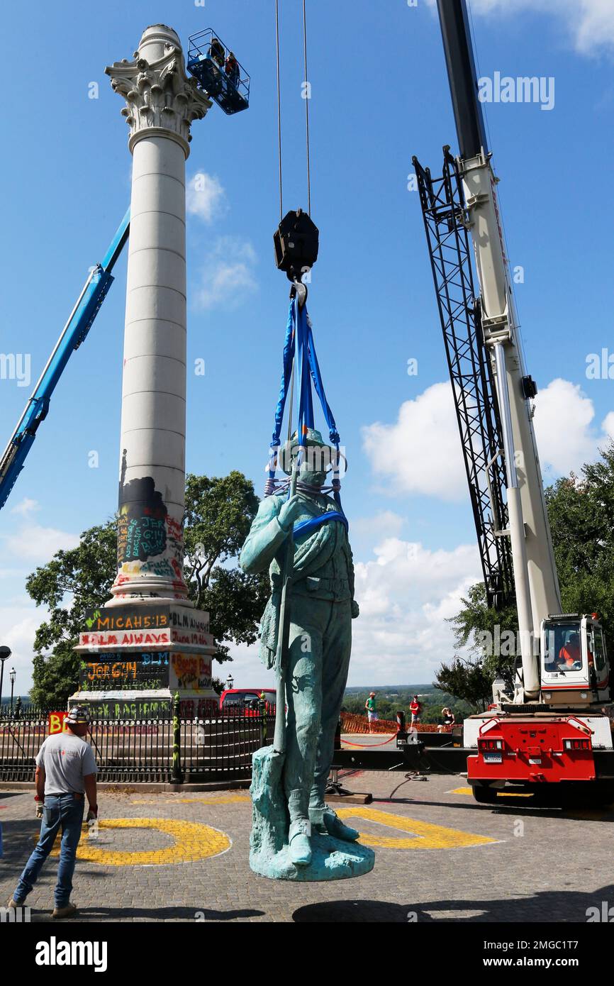 The Confederate Soldiers & Sailors Monument statue is lowered to the ...