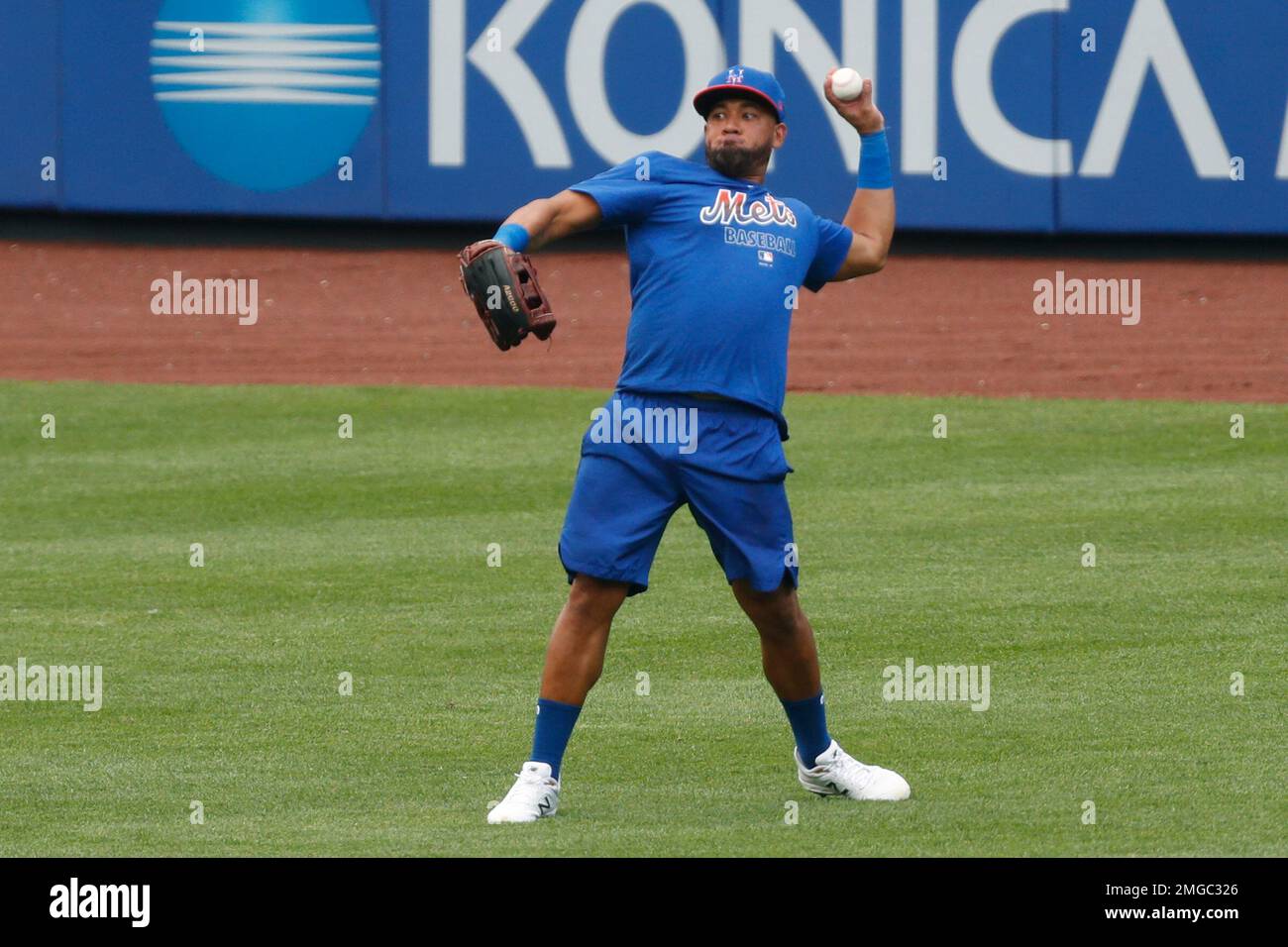 New York Mets outfielder Melky Cabrera trows fro the outfield during a ...
