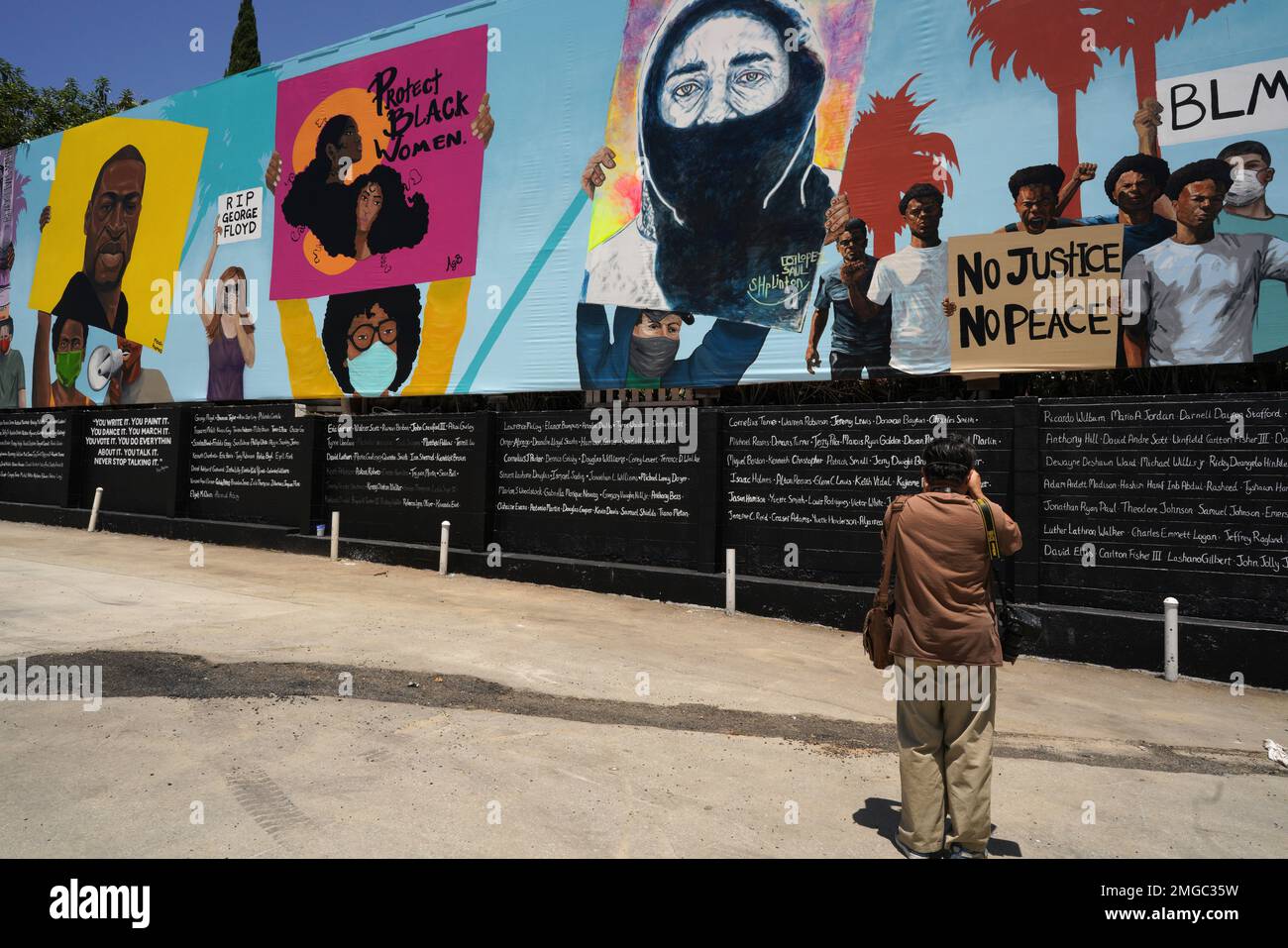 A photographer takes a photo during the unveiling of a 148-foot tribute ...