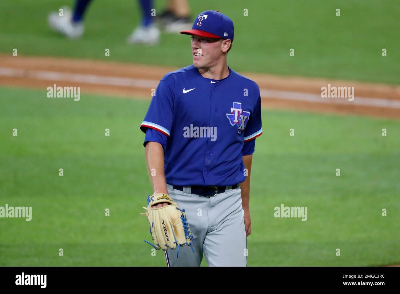 Texas Rangers pitcher Kolby Allard walks off the field after throwing ...