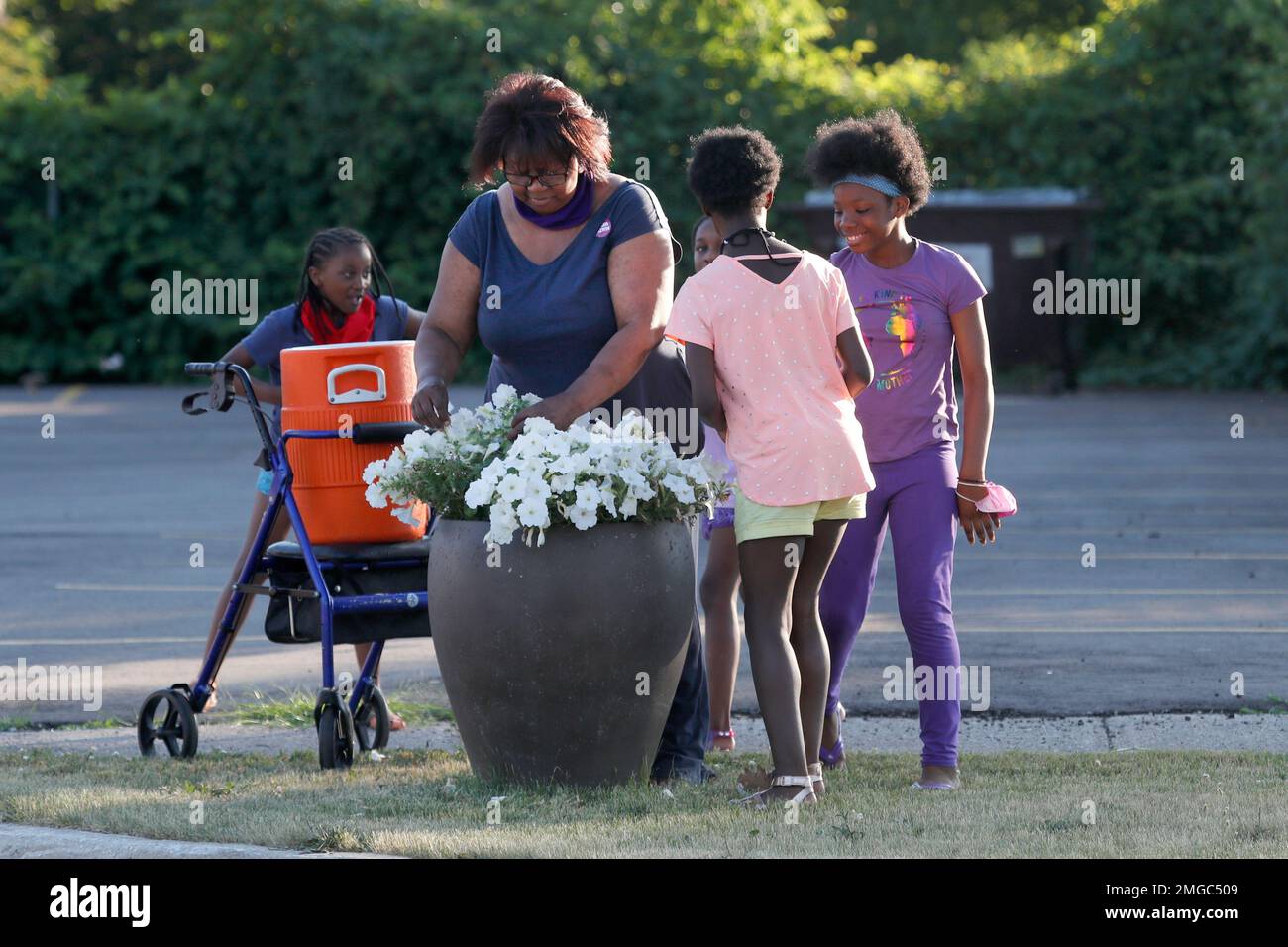 Pastor Charlene Washington attends to flowers Monday, June 29, 2020 ...