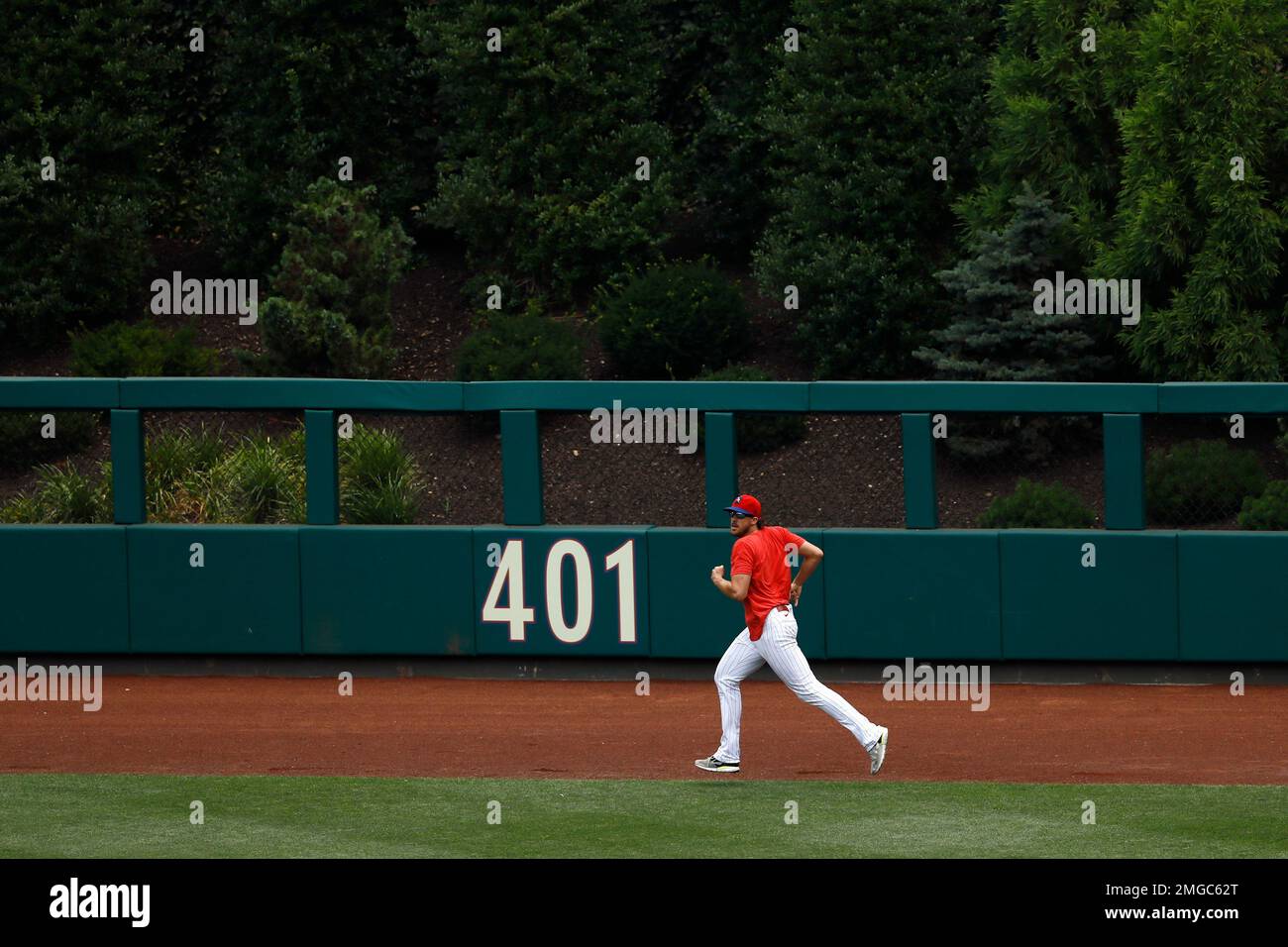 Philadelphia Phillies' Aaron Nola jogs the outfield during baseball ...