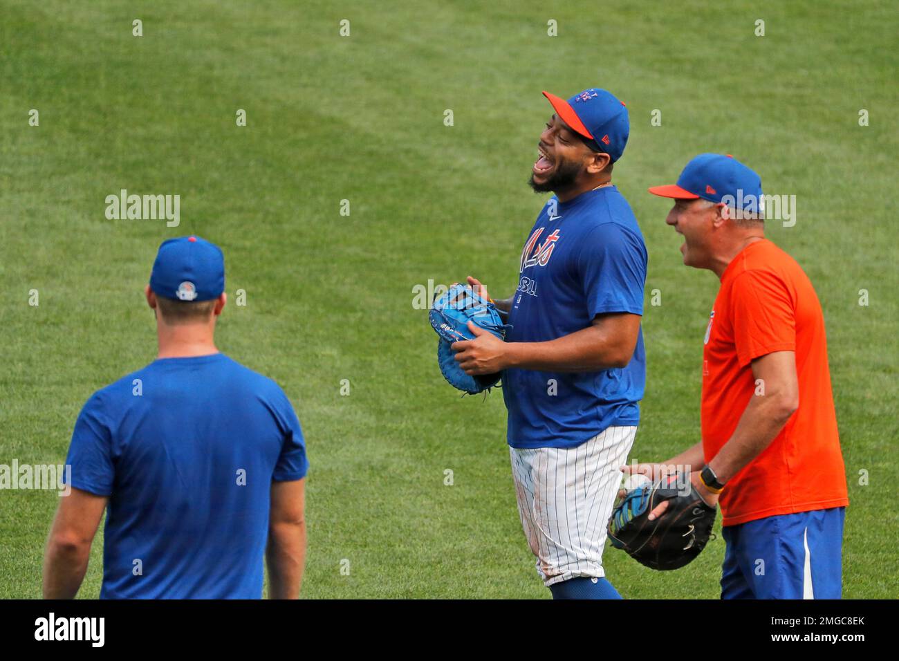 New York Mets first baseman Dominic Smith laughs during a baseball ...