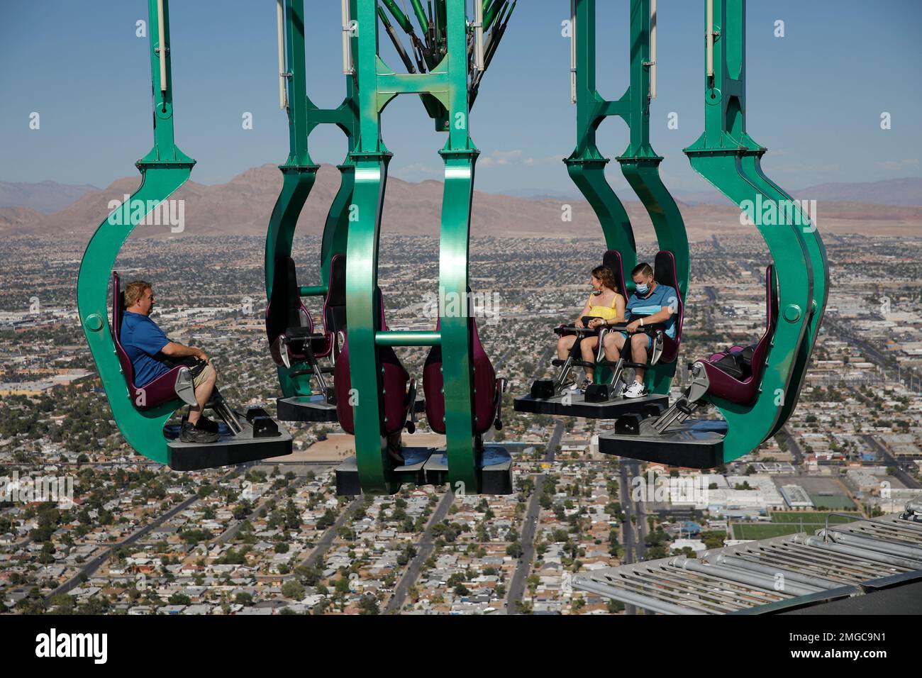 People ride a thrill ride above the Las Vegas valley on the Fourth of ...