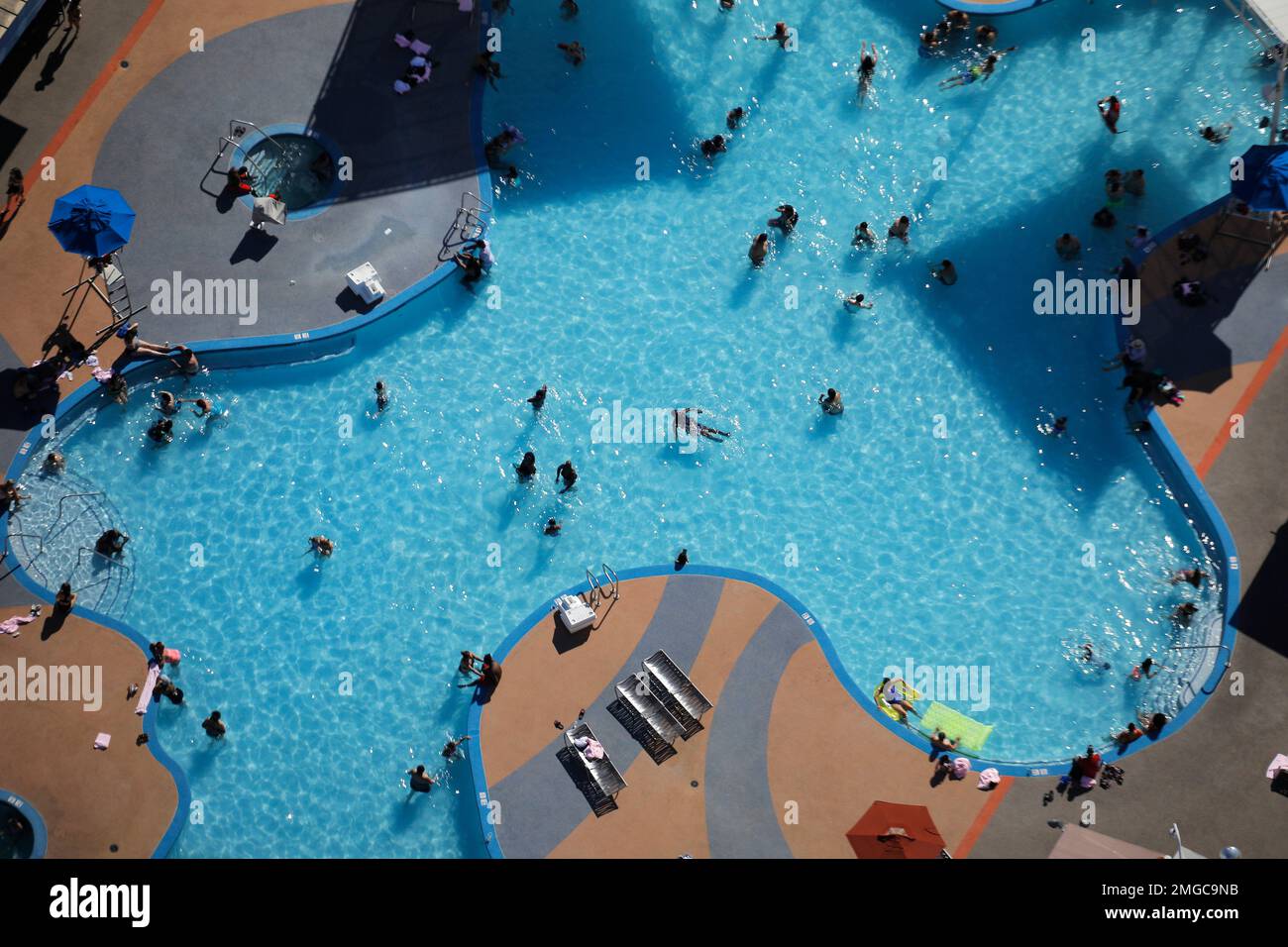 People swim on the Fourth of July in a pool at the Strat hotel-casino ...