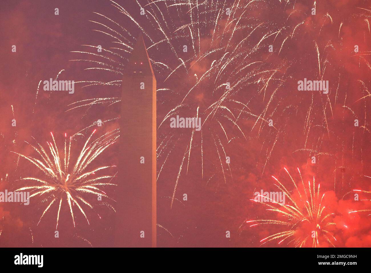 Fireworks explode around the Washington Monument during a "Salute to ...
