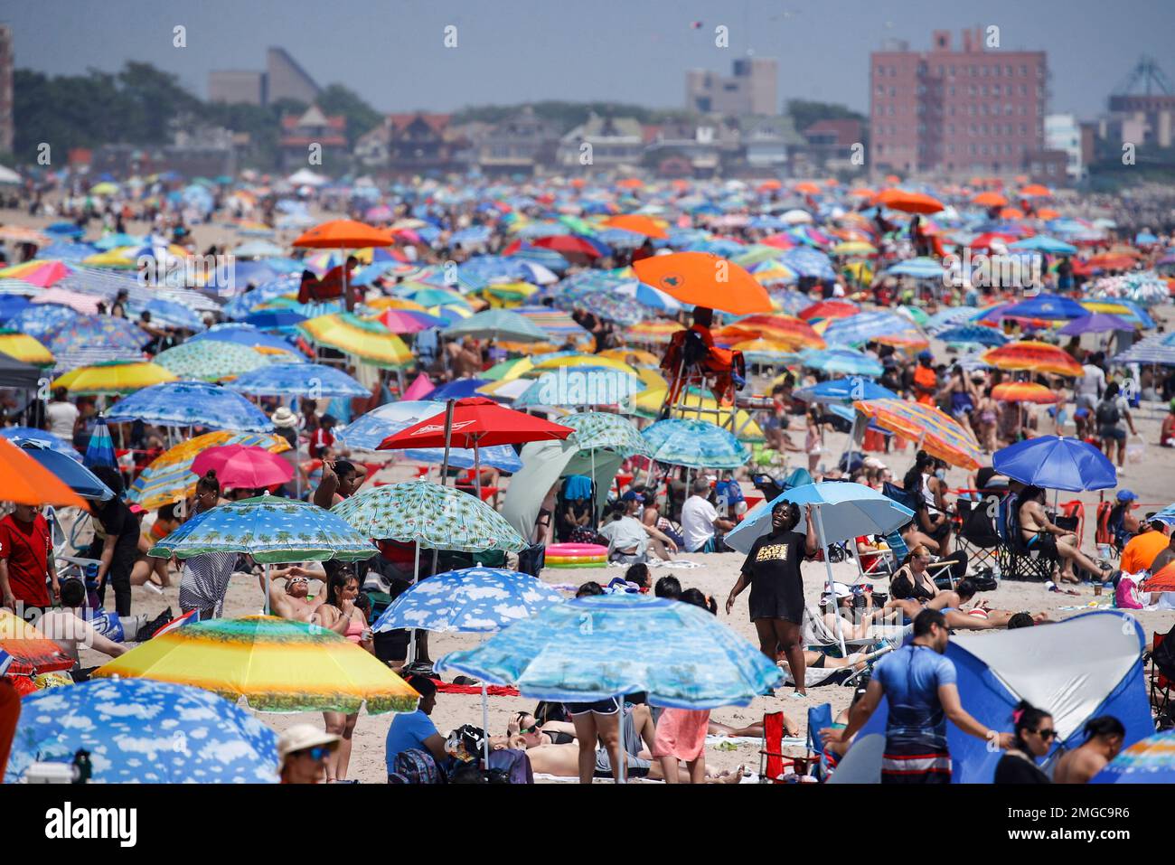Revelers enjoy the beach at Coney Island, Saturday, July 4, 2020, in ...