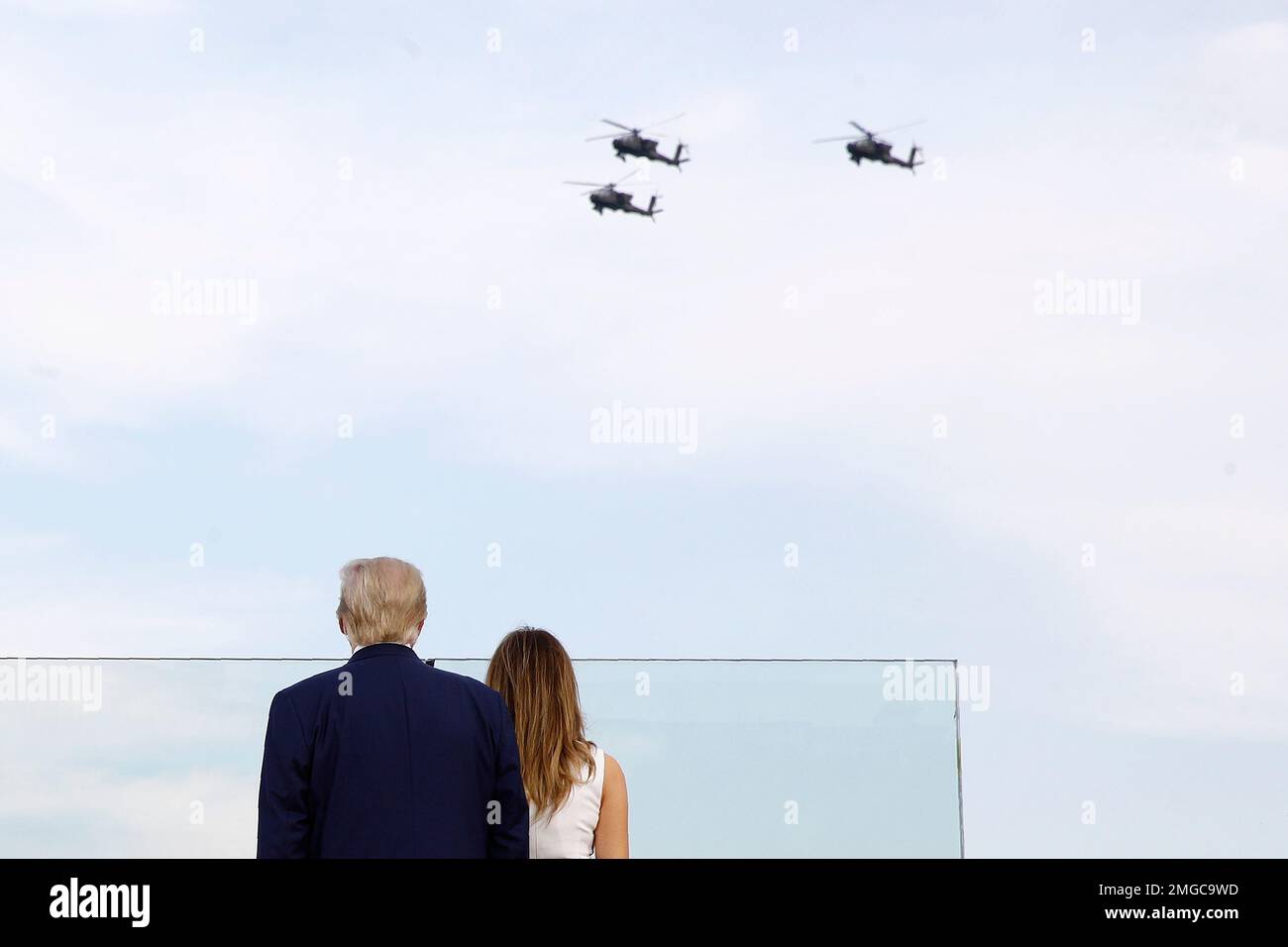 President Donald Trump and first lady Melania Trump watch as military ...