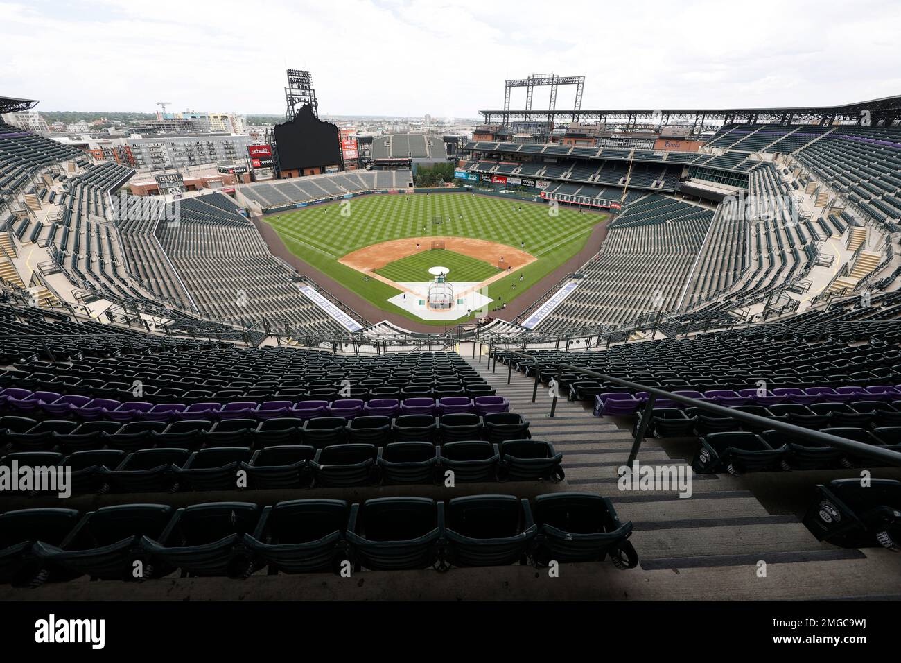 Colorado Rockies players warm up as the team practices in Coors Field ...