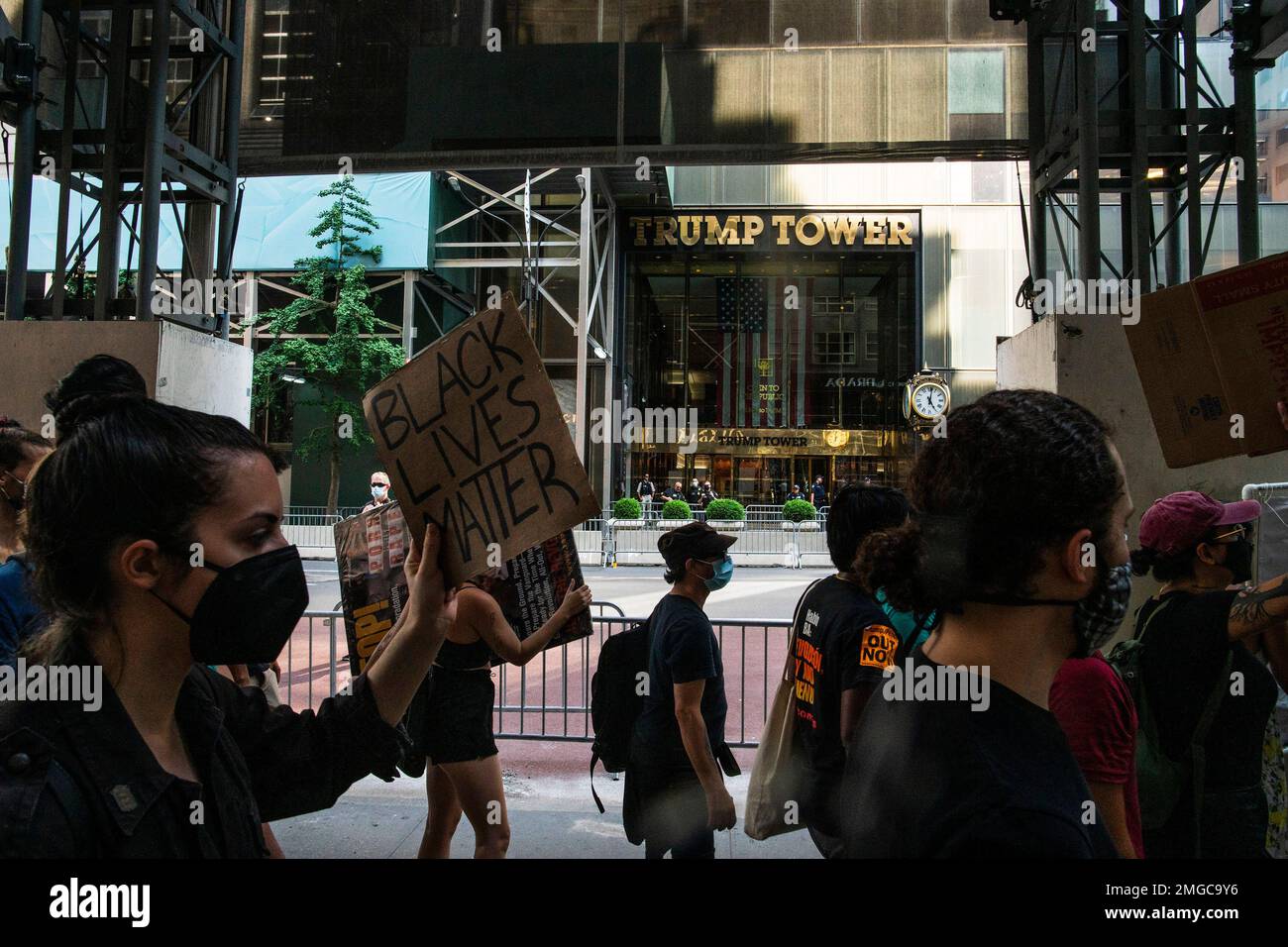 Protesters arrive to Trump Tower on Fifth Avenue during a protest ...