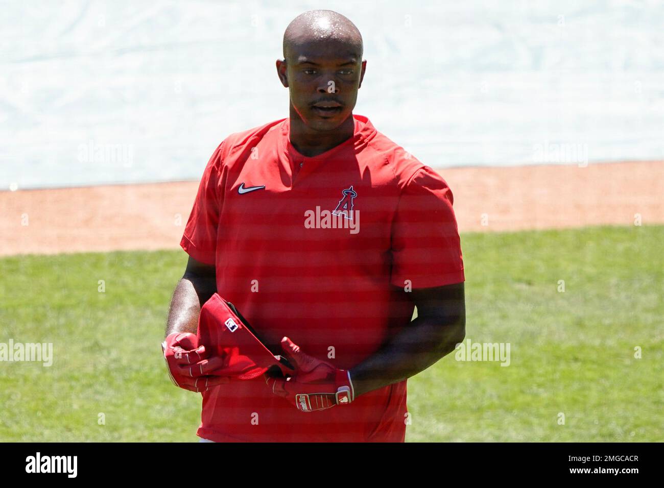 Los Angeles Angels left fielder Justin Upton walks to the dugout during ...