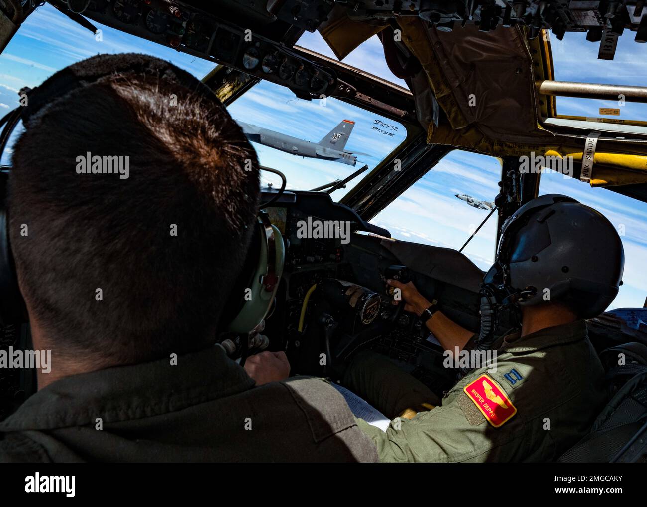 U.S. Air Force 23rd Expeditionary Bomb Squadron Pilots Capt. Ryan “Clipper” Reers (left) and ...