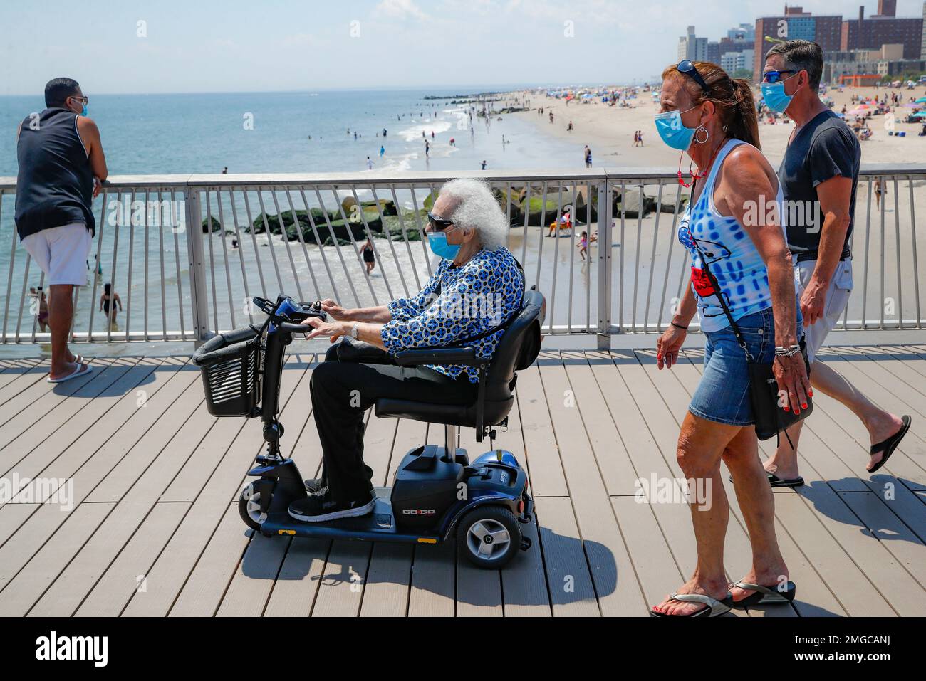 Revelers enjoy the beach at Coney Island, Saturday, July 4, 2020, in ...