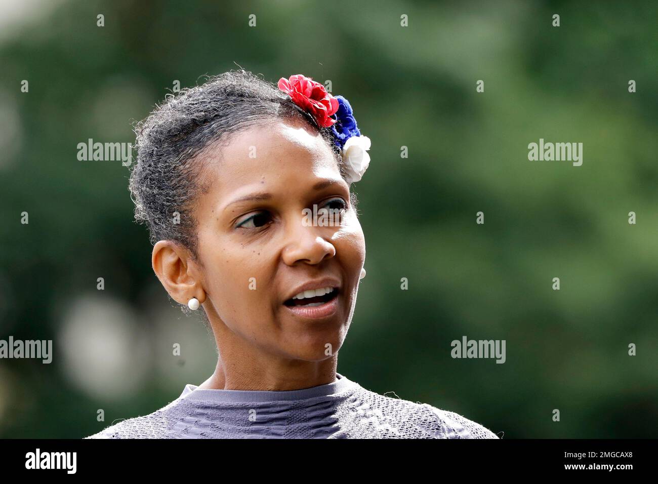 Army veteran Shanda Taylor Boyd wears her hair decorated with red ...