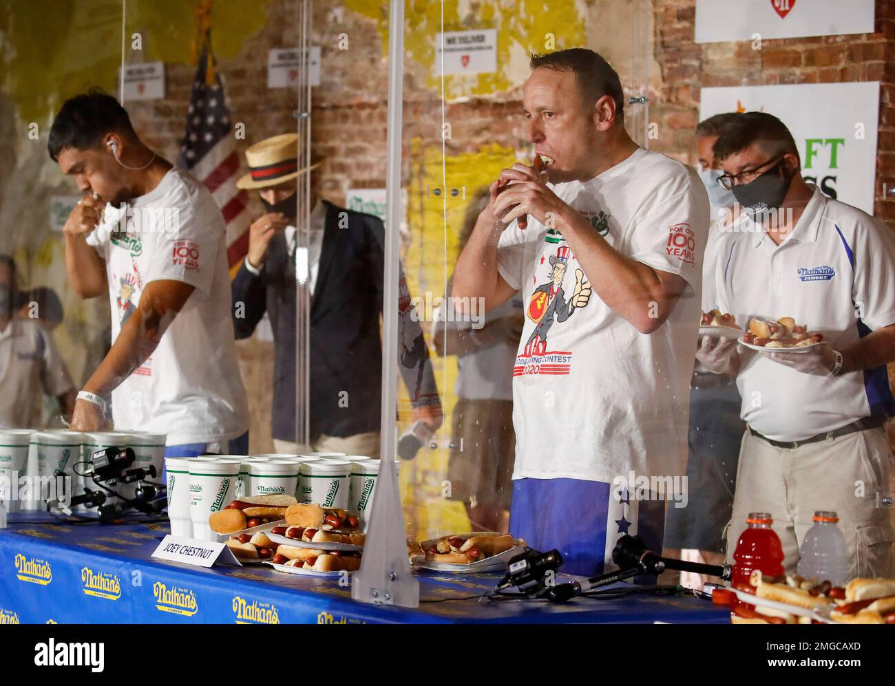 Competitive eater Joey Chestnut sets a new world record with 75 hot ...