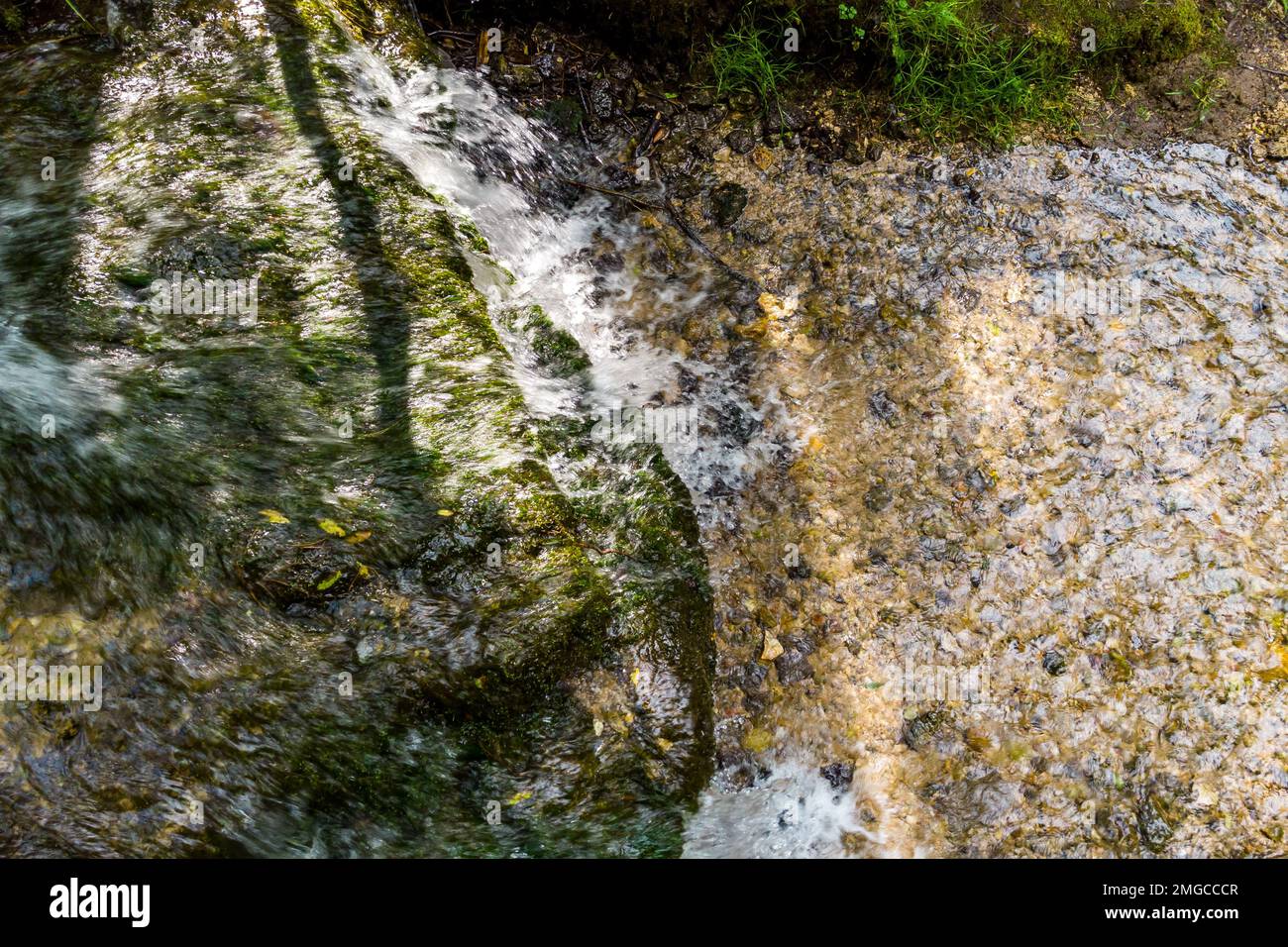 Top view of the stream flow and falling water from small limestone ...