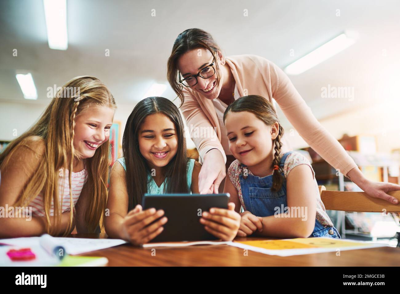 What are you girls up to. a group of cheerful young school girls ...