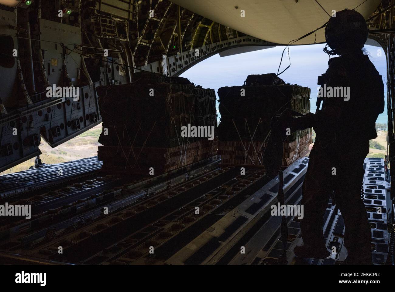 Senior Airman Jolan Besse, 535th Airlift Squadron loadmaster, observes ...
