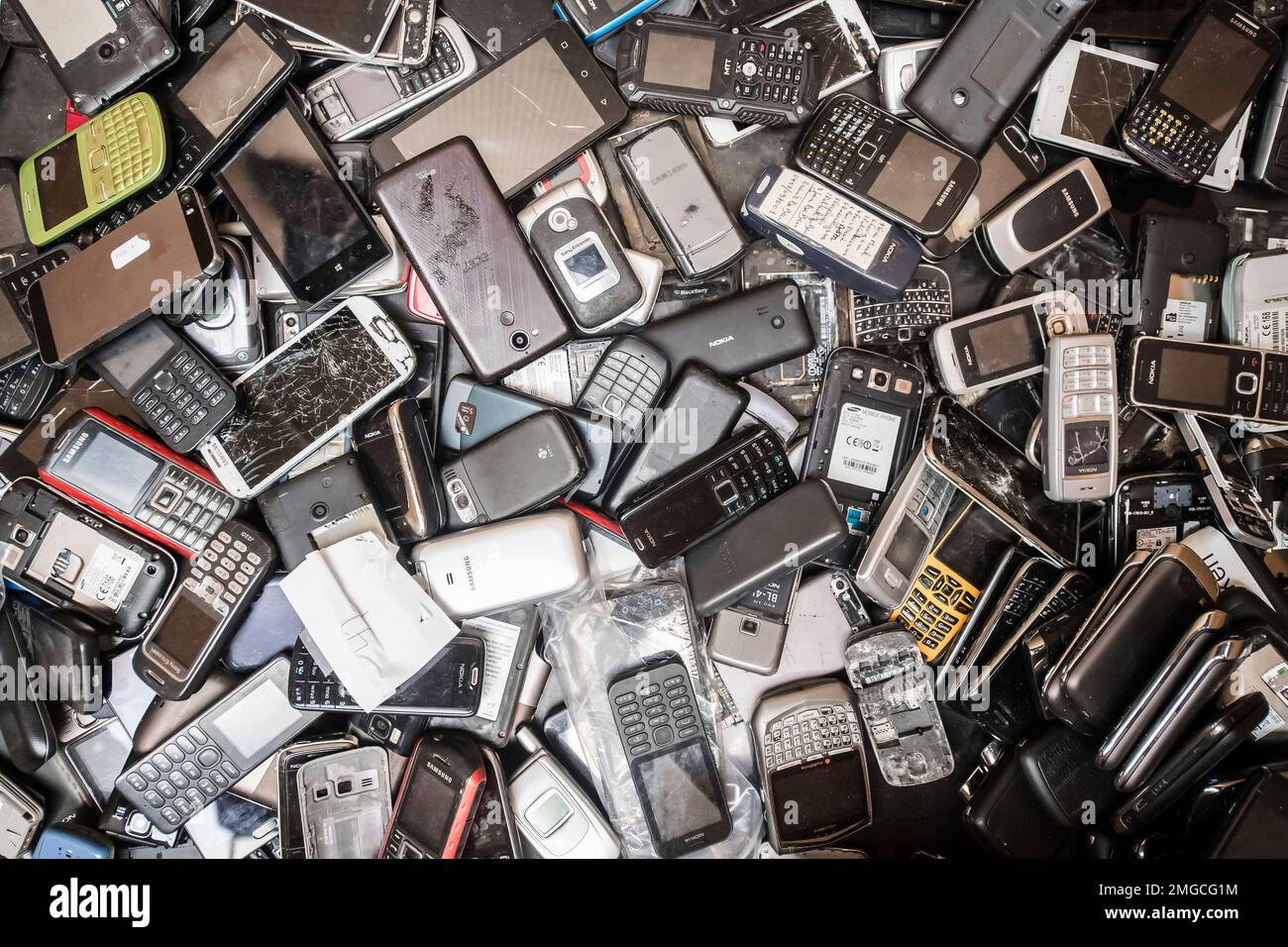 In this photo taken on July 13, 2018, old mobile phones fill a bin at ...