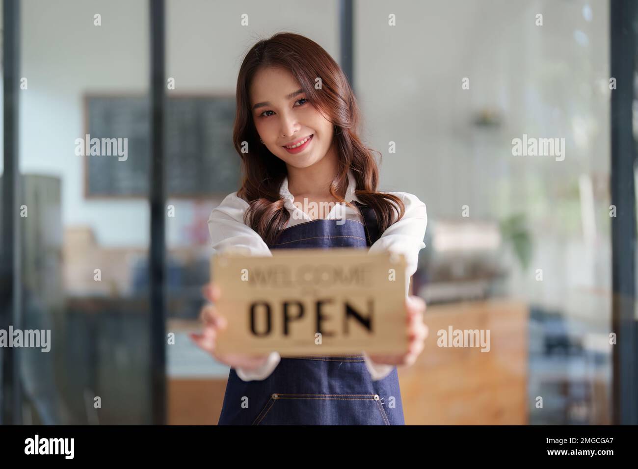 Beautiful female manager in restaurant with tablet. Man coffee shop ...