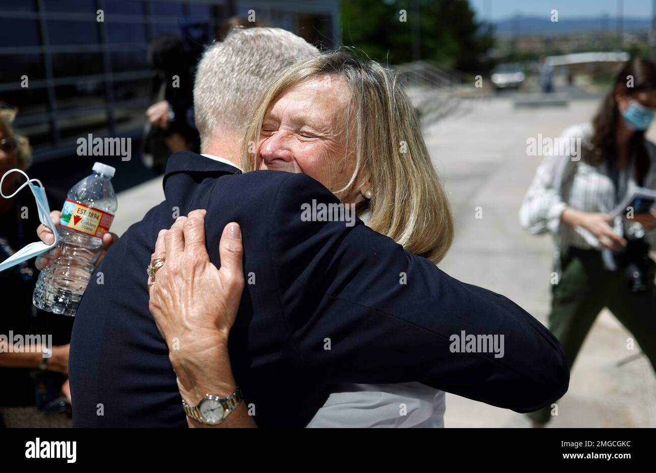 Janet Johnson of Pawcatuck, Conn., right, hugs George Brauchler, 18th ...