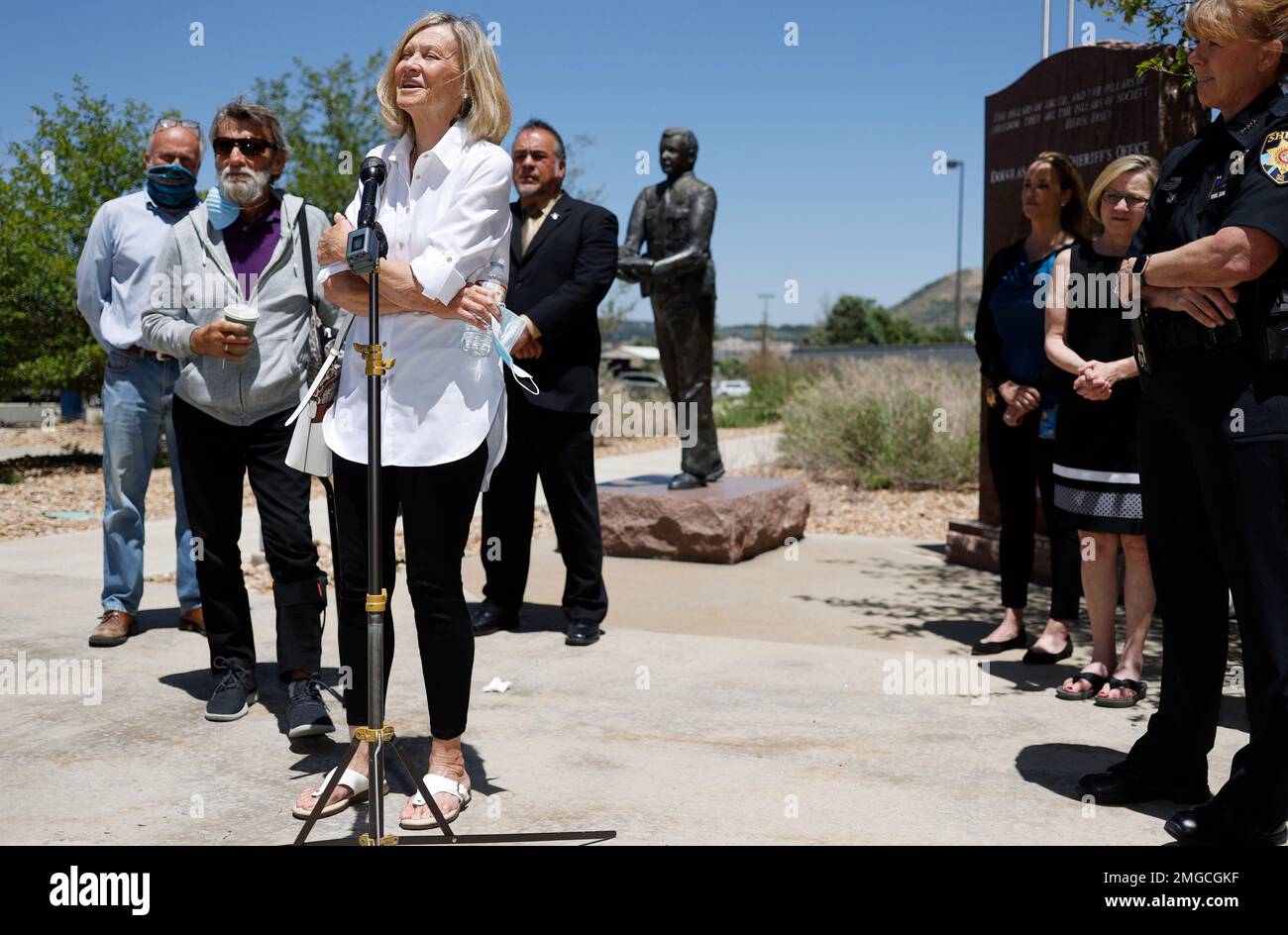 Janet Johnson of Pawcatuck, Ct., front, speaks at a news conference ...