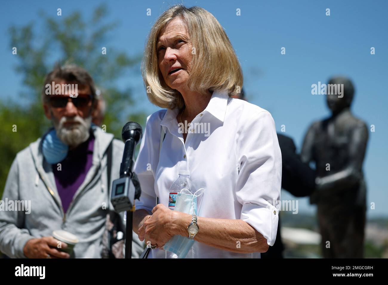 Janet Johnson of Pawcatuck, Ct., front, speaks at a news conference ...
